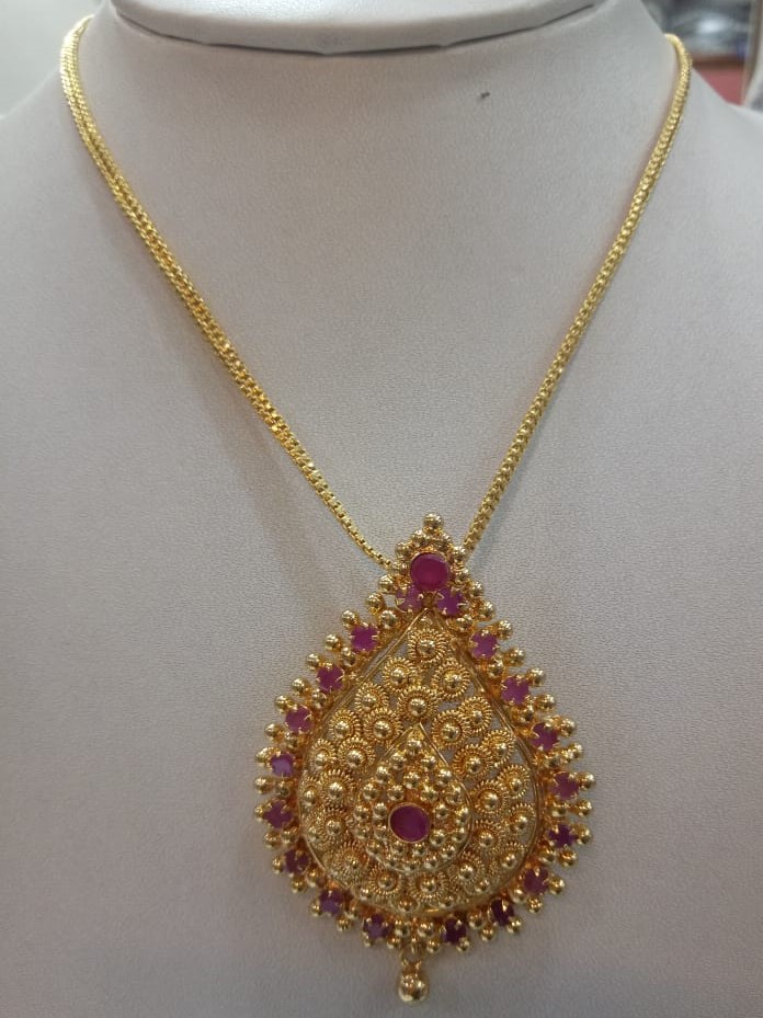 25. Beautiful locket with art ruby stones around: Krishna Culture